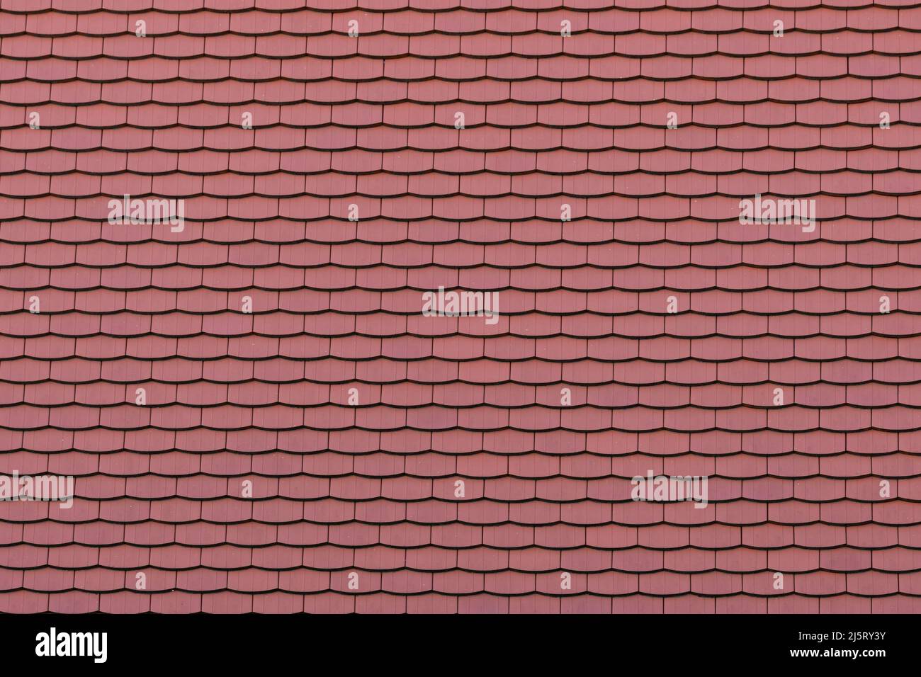 Red tiles on a roof texture. Background structure for the use as ...