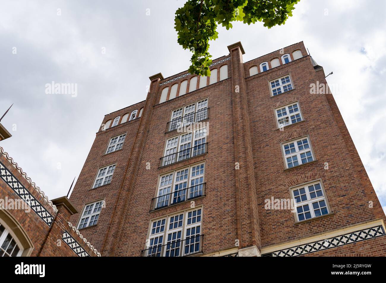 Facade of a high rise building in hanseatic architecture style. House ...