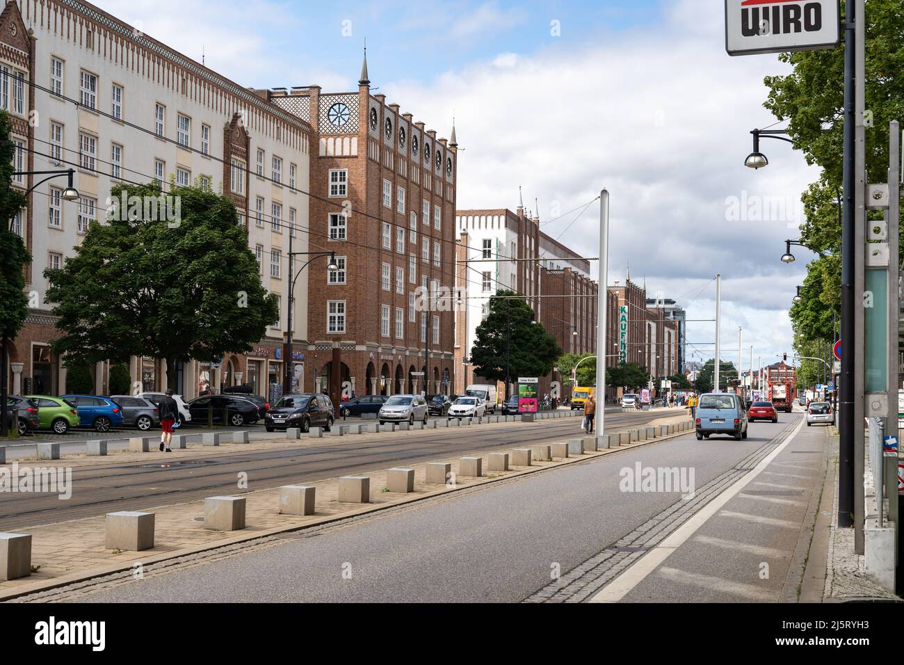 Street named Lange Strasse in the city with a lot of cars and people ...