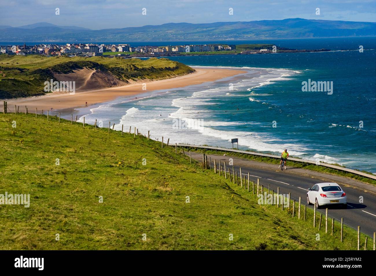 A car driving the Causeway Coastal route at the Whterocks and Portrush ...