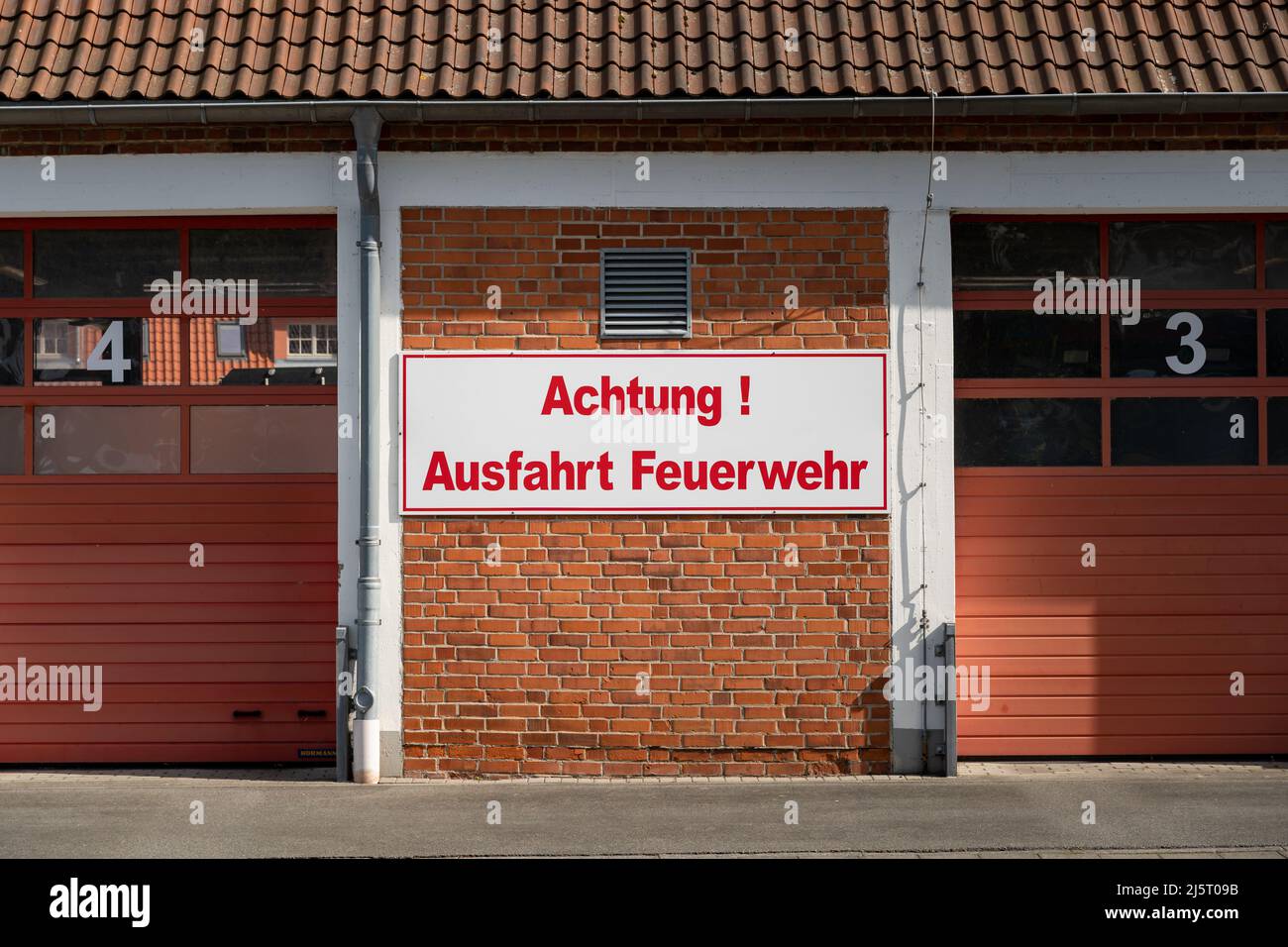 Emergency access road in front of a fire department. Facade of the ...