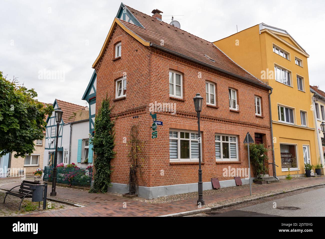 Red clinker facade of an old house in a small town in Germany. Street ...