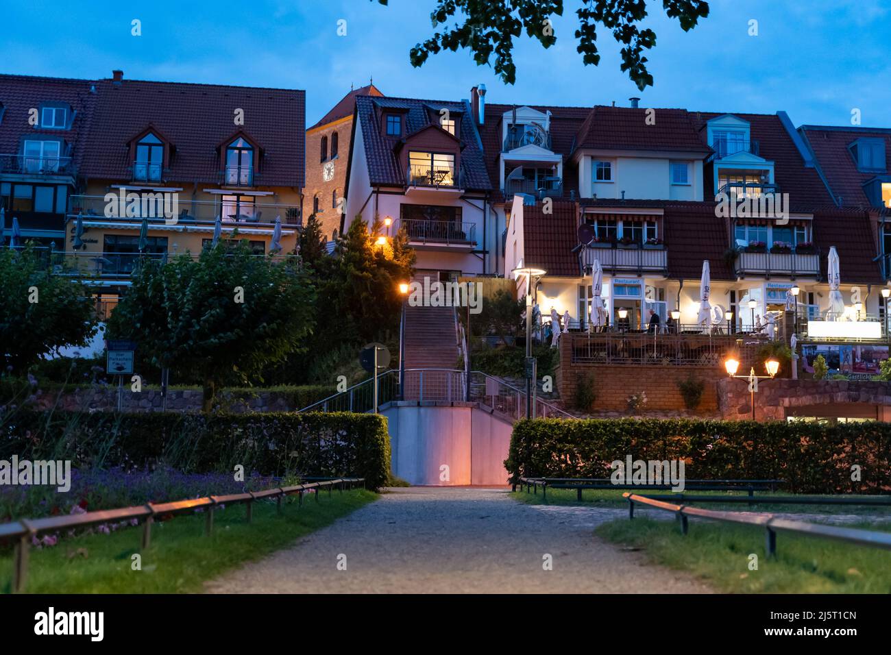 Small buildings in the city next to the street. Neighbourhood in Waren ...