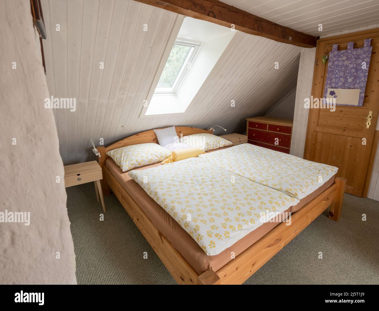 Big bed in a cozy retro bedroom. Vintage furniture in a hotel room ...