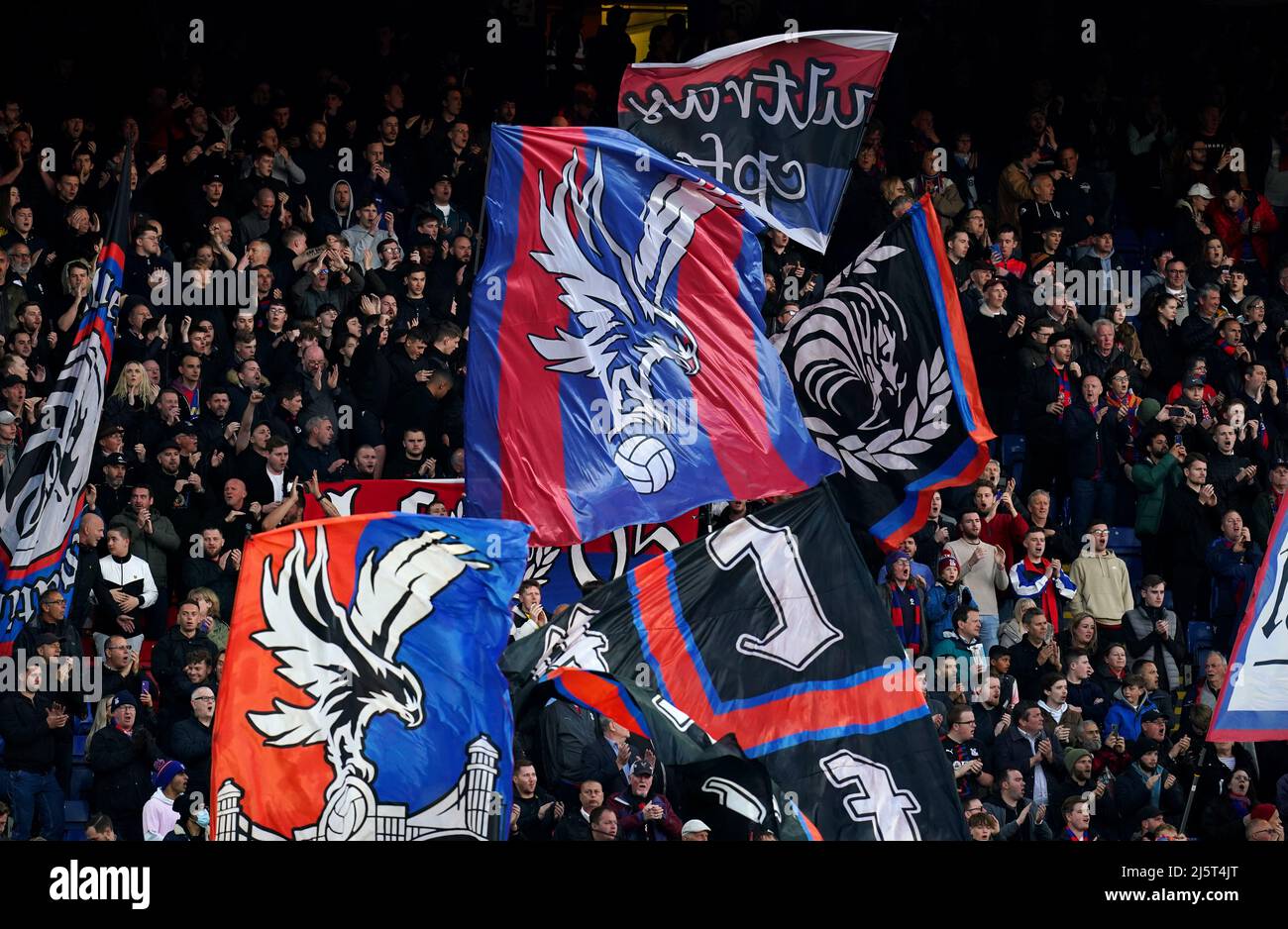 Crystal Palace fans wave flags in the stands before the Premier League ...