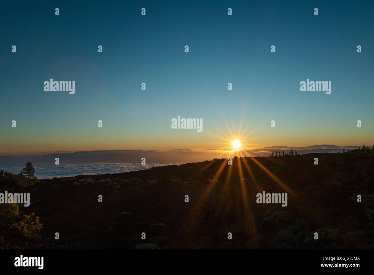 Setting sun over the volcano hi-res stock photography and images - Alamy