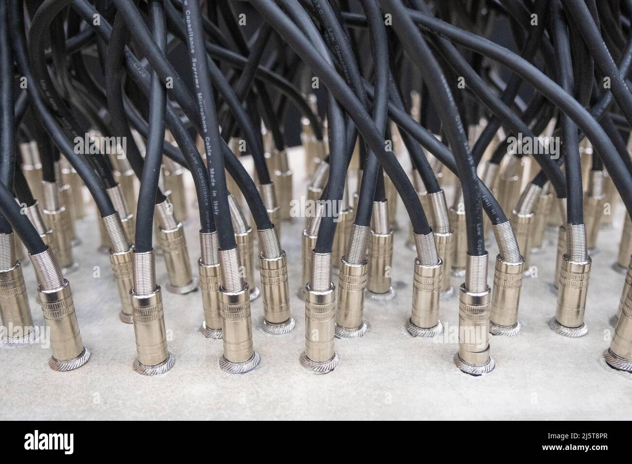 Audio jack cable connected at rear end of mixer at broadcasting,shallow ...