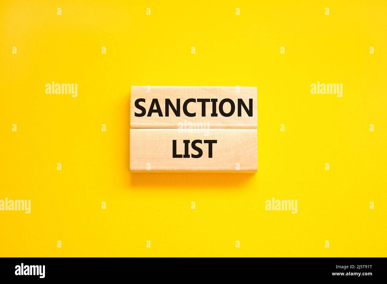 Sanction list symbol. Wooden blocks with concept words Sanction list on ...