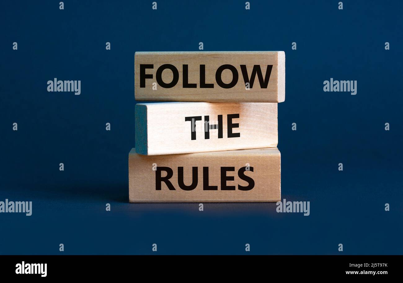 Follow the rules symbol. Concept words Follow the rules on wooden ...