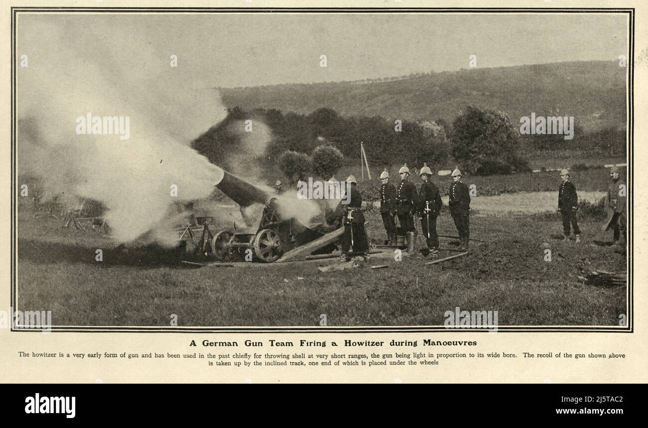 Artillery gun team firing a howitzer, German army in the Manouvre field ...