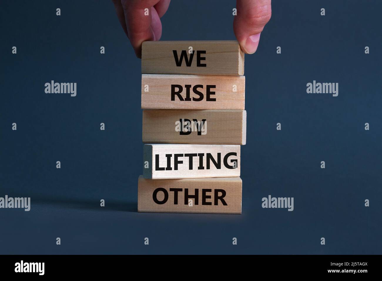 We rise by lifting other symbol. Concept words We rise by lifting other ...