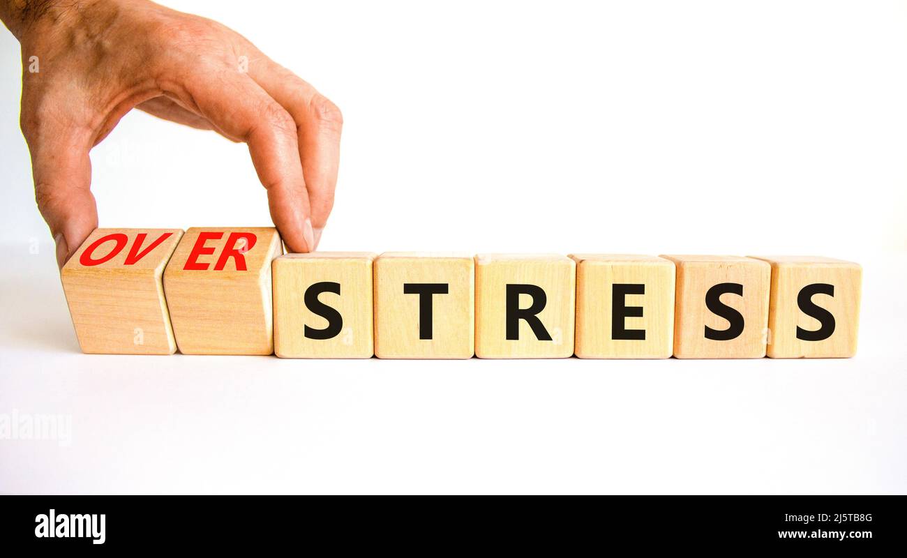Over stress symbol. Psychologist turns wooden cubes and changes the ...