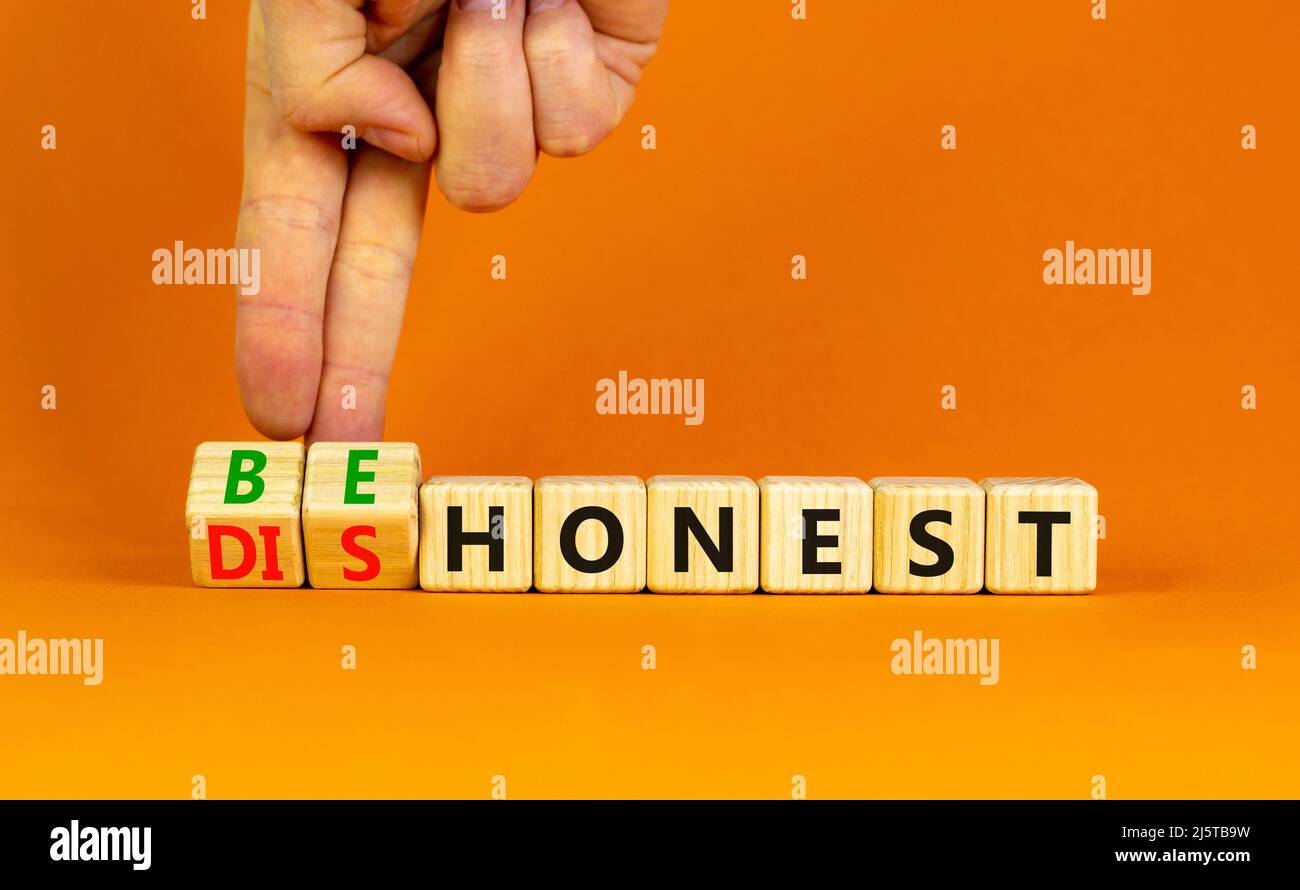 Be honest or dishonest symbol. Businessman turns cubes and changes ...