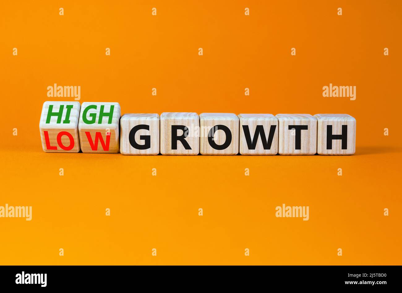 High or low growth symbol. Turned wooden cubes and changed concept ...