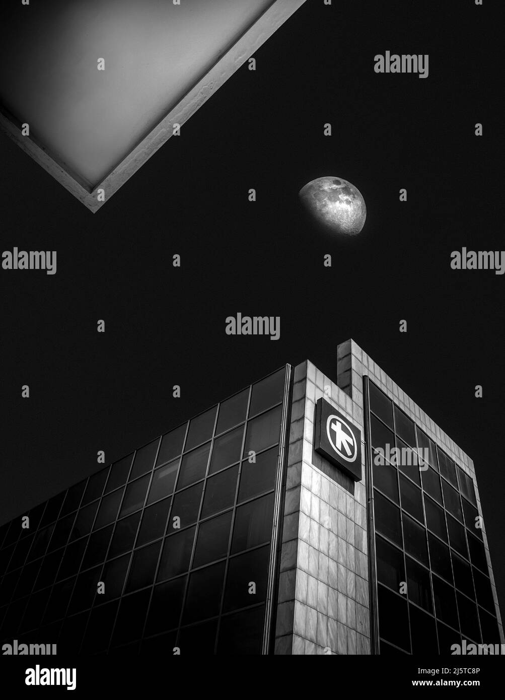 Fine art nightscape photo with the moon between two buildings Stock ...