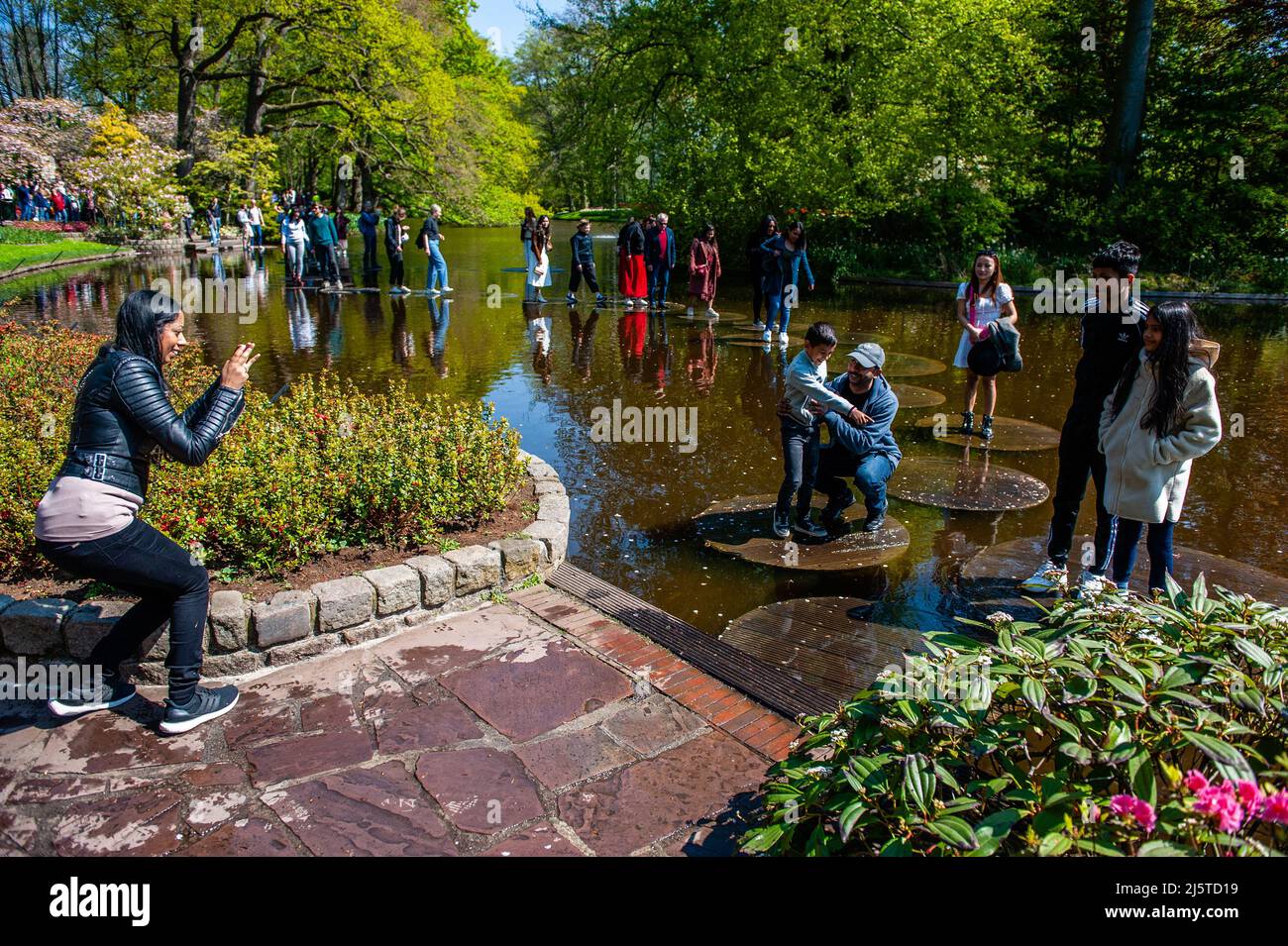 Lisse, Netherlands. 24th Apr, 2022. A woman seen taking photos of her ...