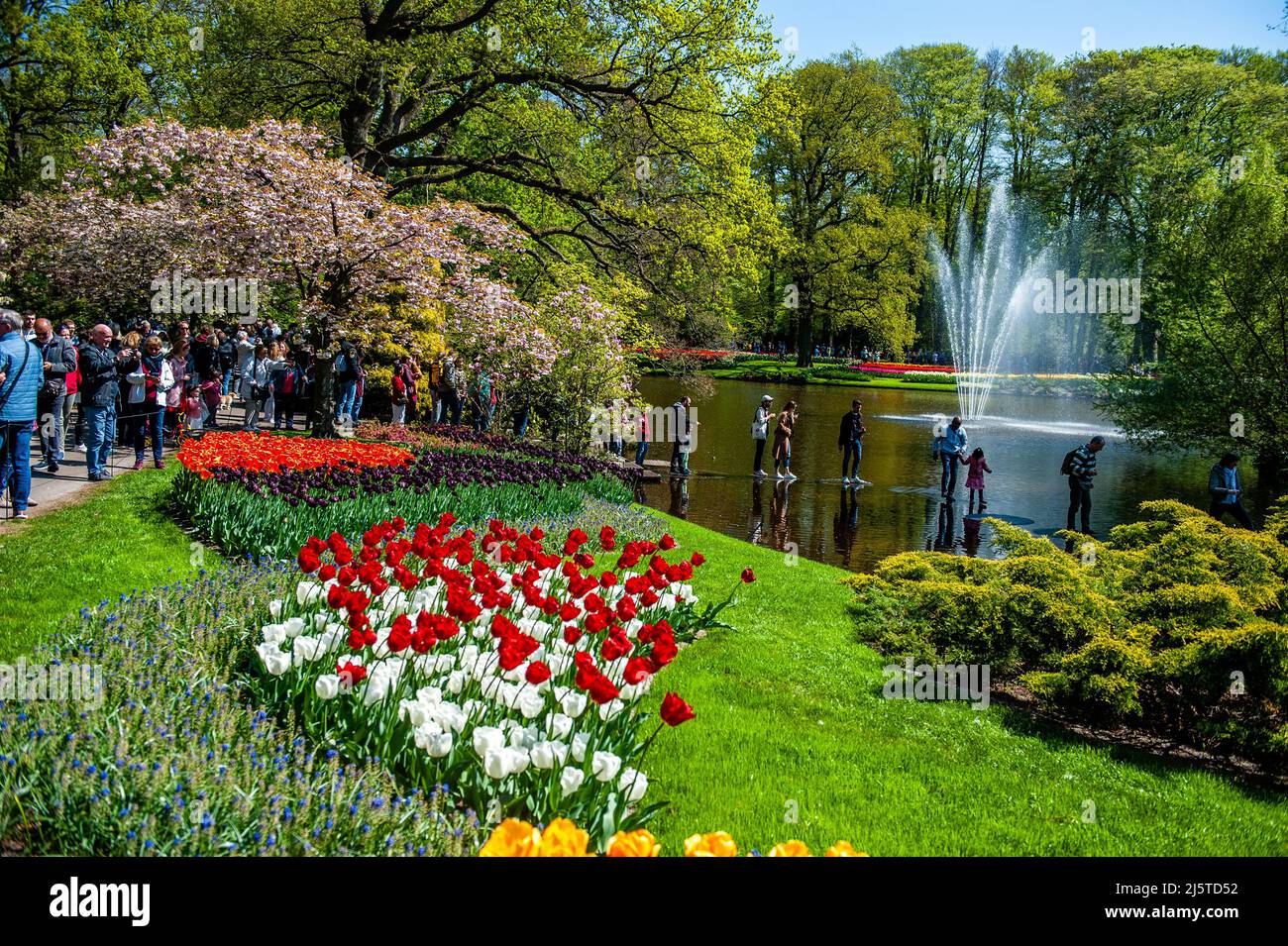Lisse, Netherlands. 24th Apr, 2022. People are seen crossing a canal ...