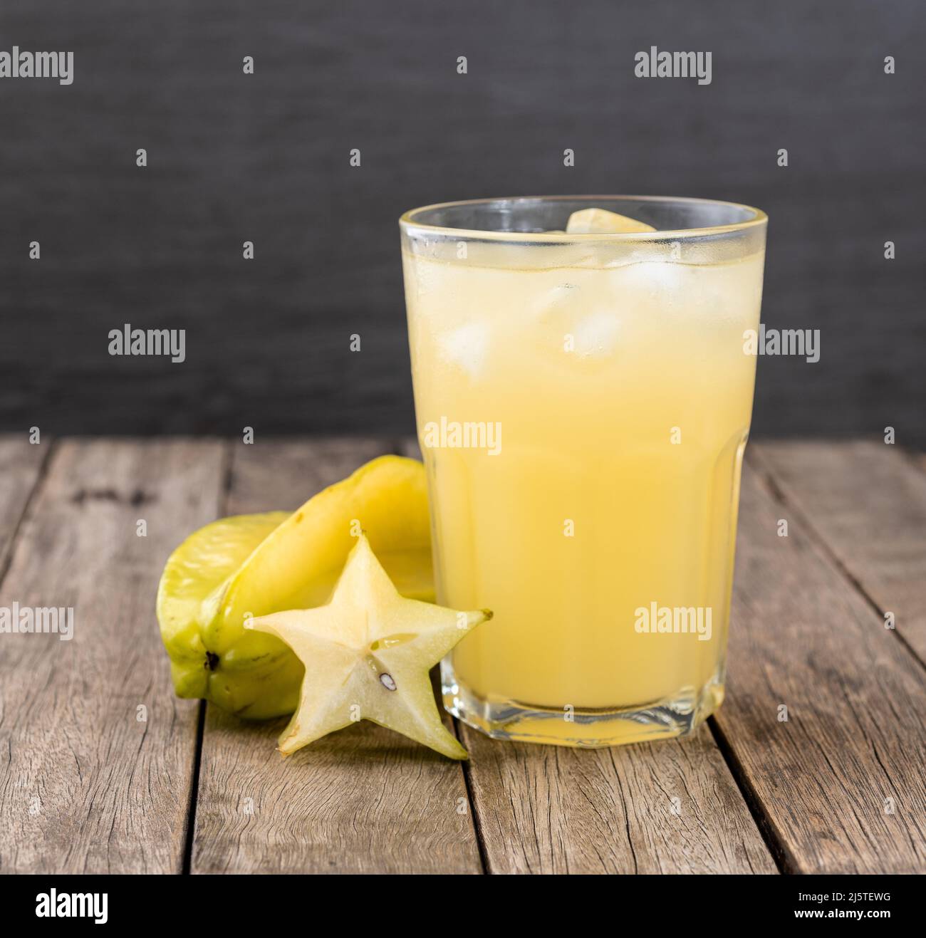 Glass of starfruit juice with ice and fruit slice Stock Photo - Alamy