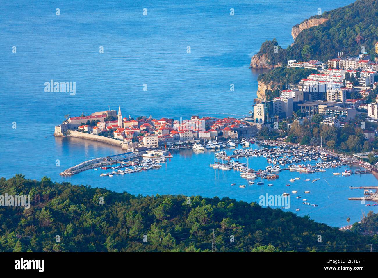 Old town and beach of Budva, Montenegro . Aerial view of coastal town ...