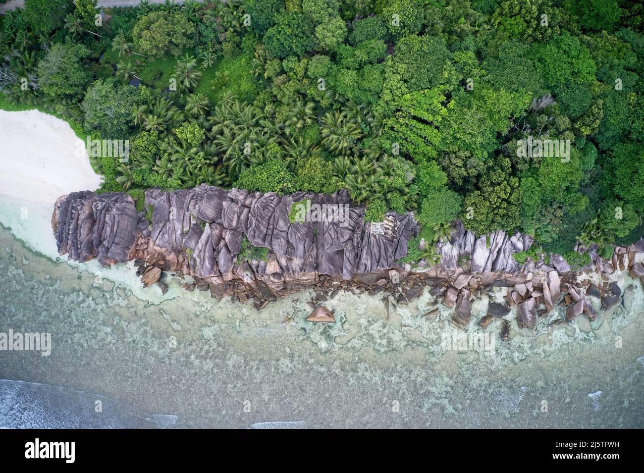 Aerial view of rocks, cliff and beach forming patterns in nature ...