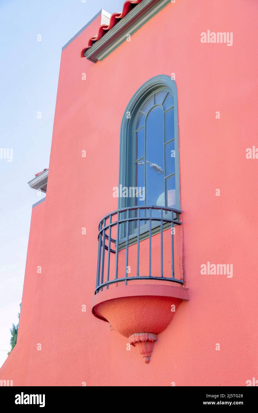 Low angle view of a building with arched window with iron railings ...