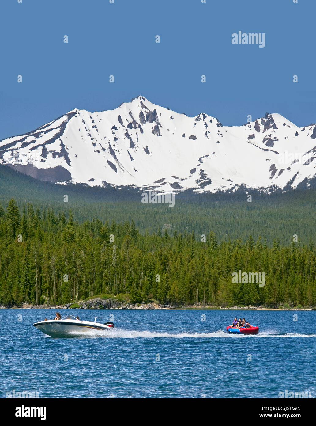 Boating Crescent Lake below Diamond Peak Wilderness, Cascade Range ...