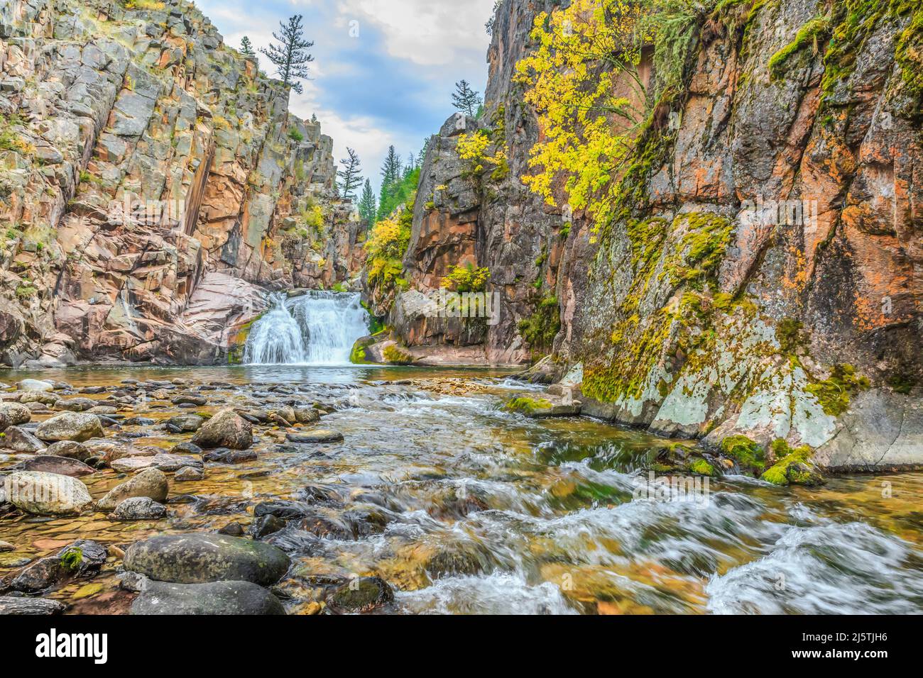 waterfall and fall colors along tenderfoot creek in the little belt ...