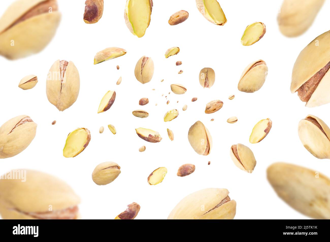 Collection of pistachio nuts falling isolated on white background ...