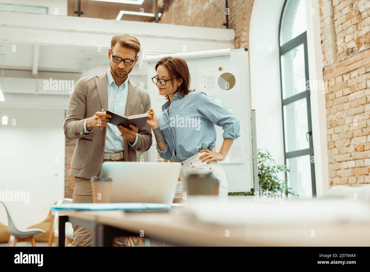Team male leader is examining teamwork results Stock Photo - Alamy