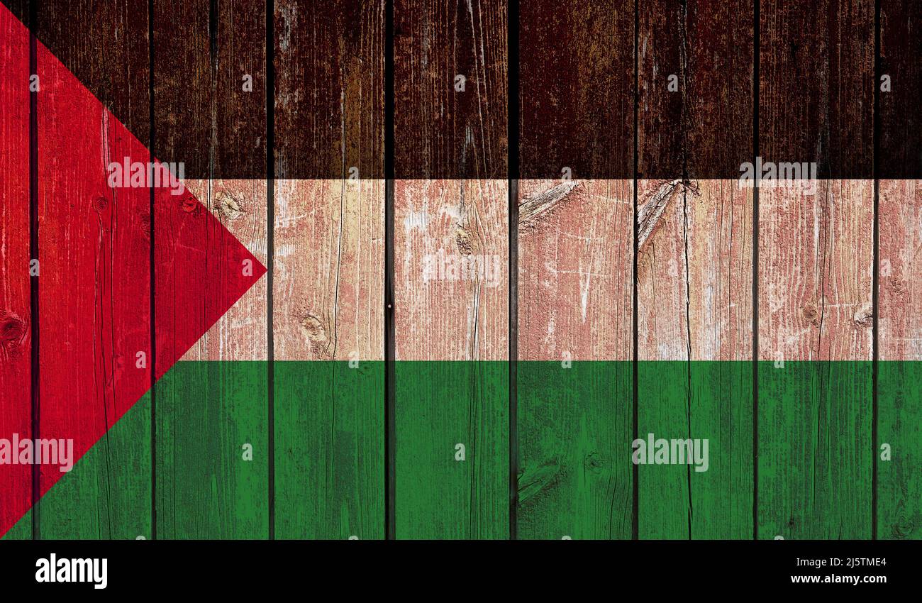 Top view of Old Painted Flag of Palestine on Dark Wooden Fence, wall ...