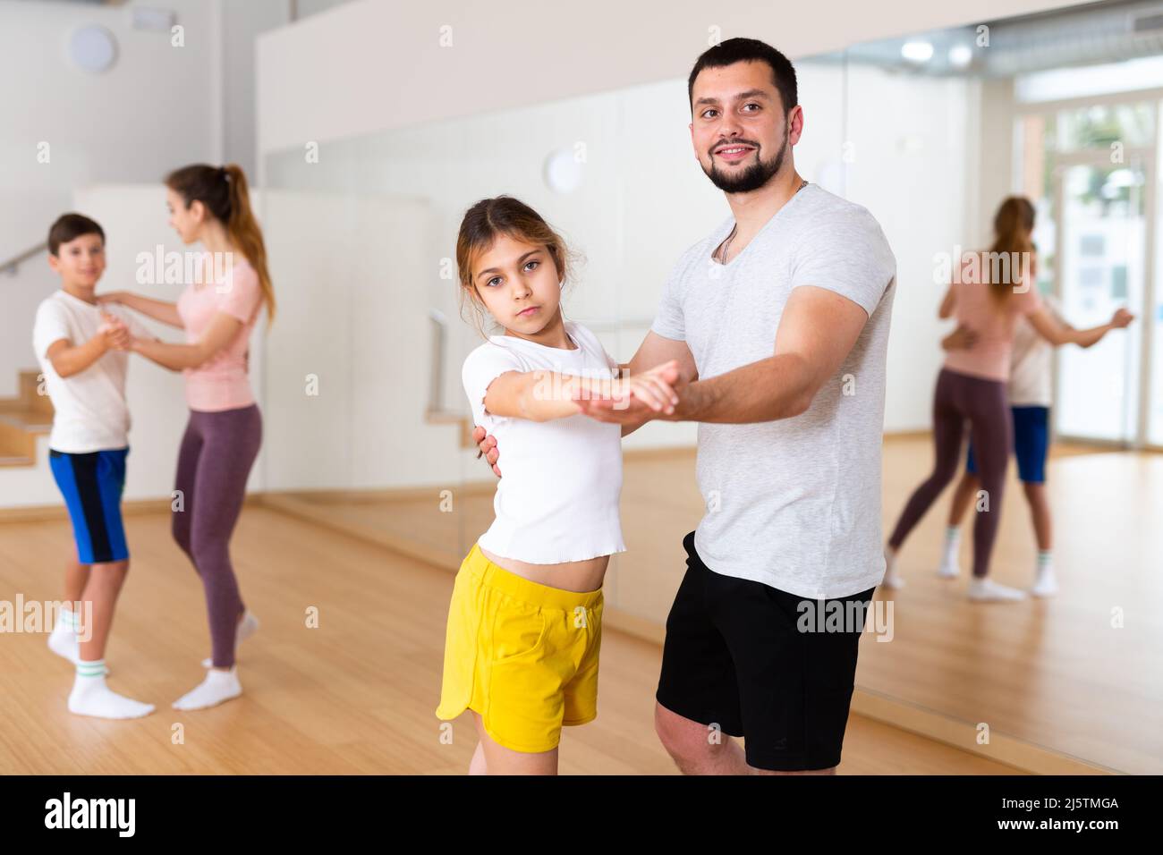 Man dancing with daughter at dance class Stock Photo - Alamy