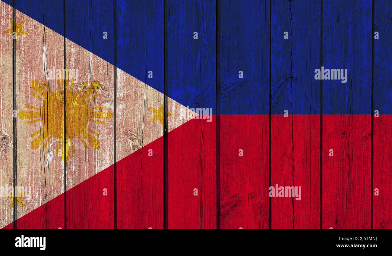 Top view of Old Painted Flag of Philippines on Dark Wooden Fence, wall ...