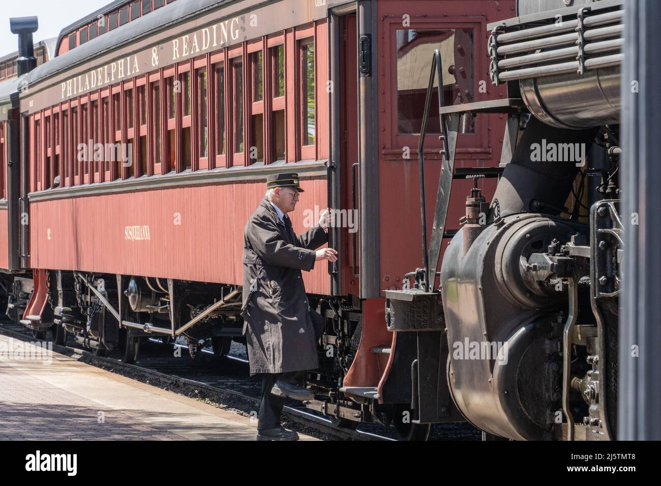 Strasburg, PA, USA - April 20,2022: Train Conductor steps onto vintage ...