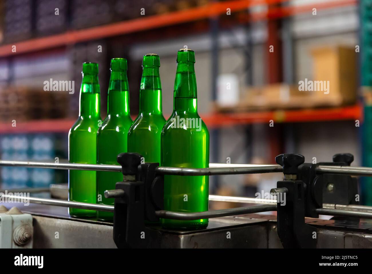 Bottles of cider on bottling line Stock Photo - Alamy