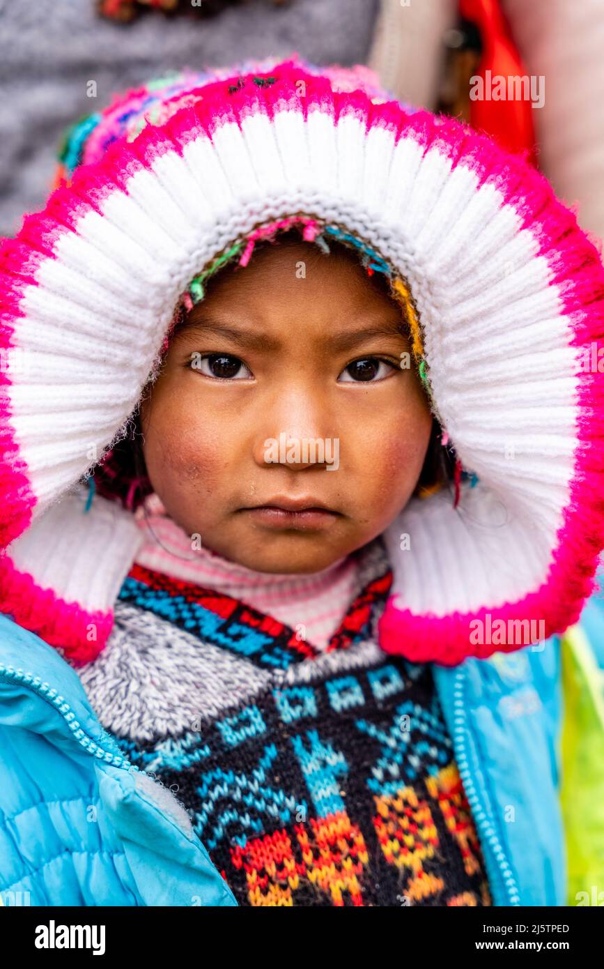 An Uros Child On The Uros Floating Islands, Lake Titicaca, Puno, Peru ...