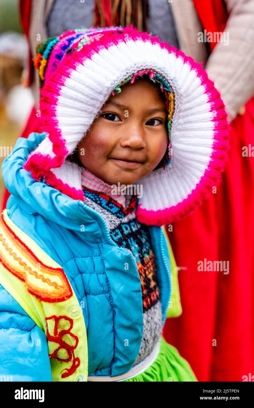 An Uros Child On The Uros Floating Islands, Lake Titicaca, Puno, Peru ...