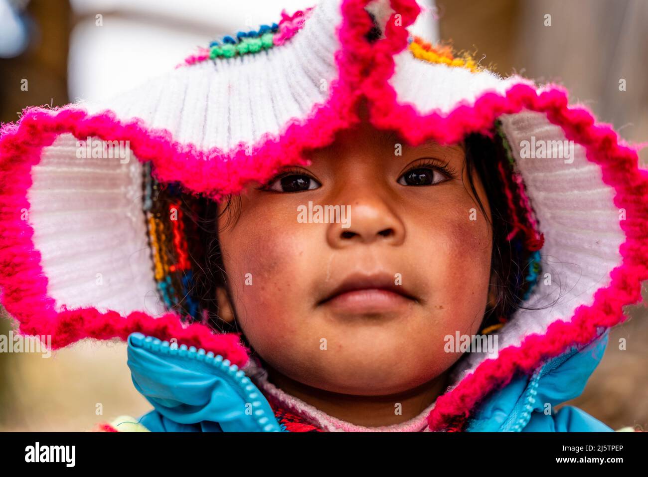 An Uros Child On The Uros Floating Islands, Lake Titicaca, Puno, Peru ...