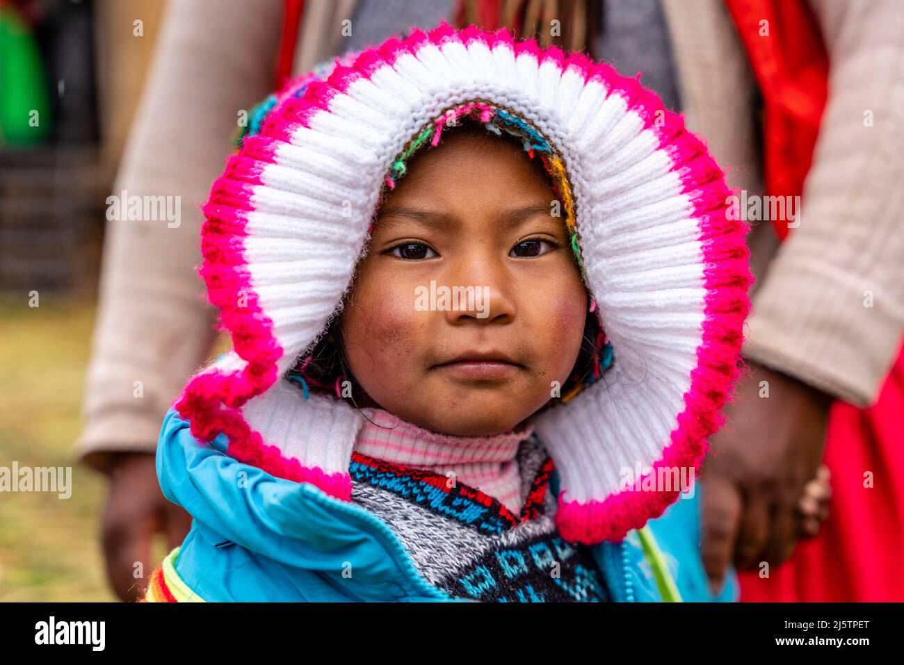 An Uros Child On The Uros Floating Islands, Lake Titicaca, Puno, Peru ...