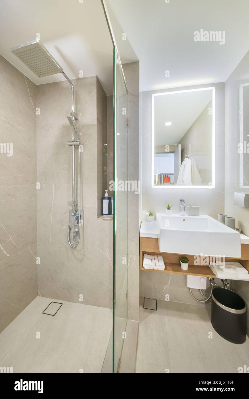 Basin in luxury bathroom interior with shower Stock Photo - Alamy