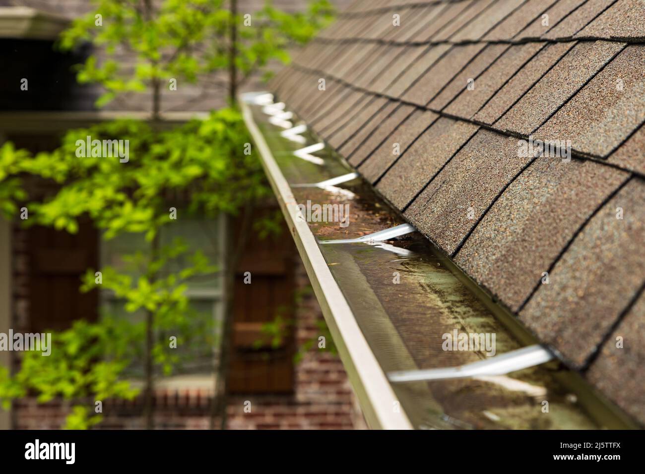 rain water overflowing in gutter Stock Photo - Alamy