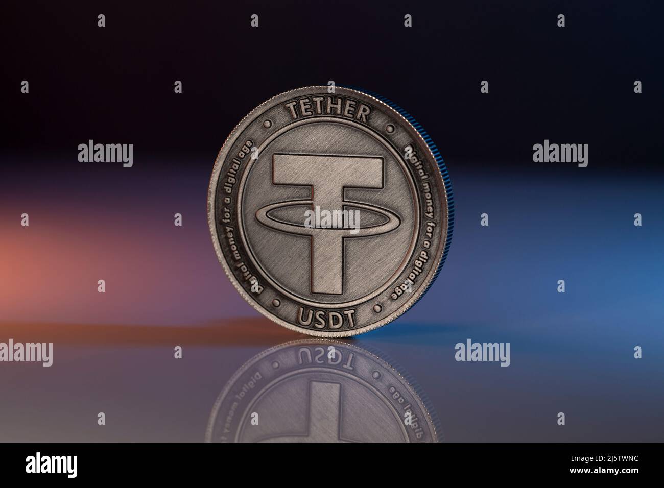 Tether USDT Cryptocurrency Physical Coin Placed on reflective surface ...