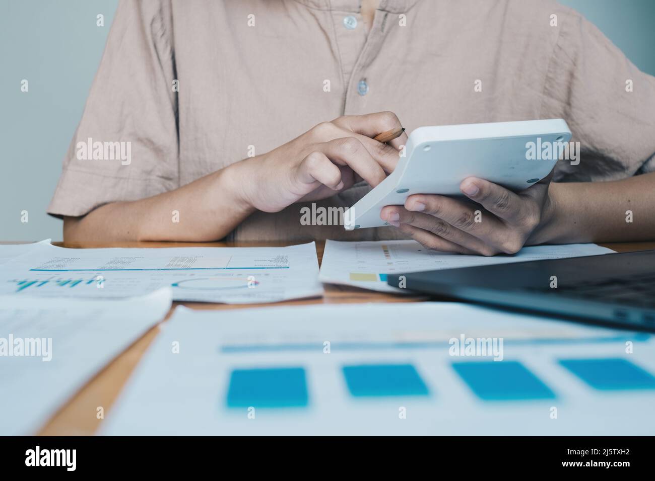 Close up Business woman hand using calculator to calculate the company ...