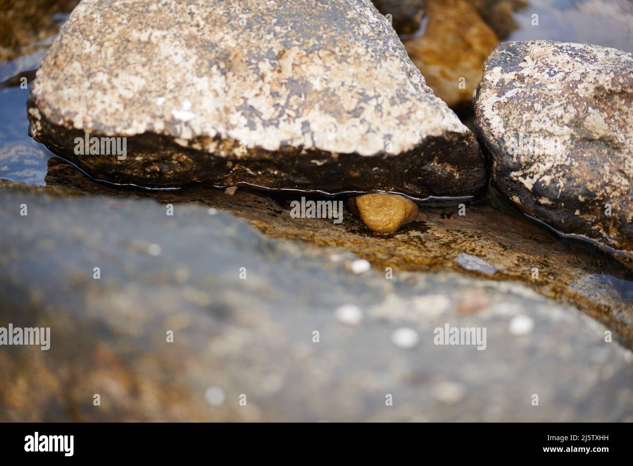 the stones are washed by the sea from all sides Stock Photo - Alamy