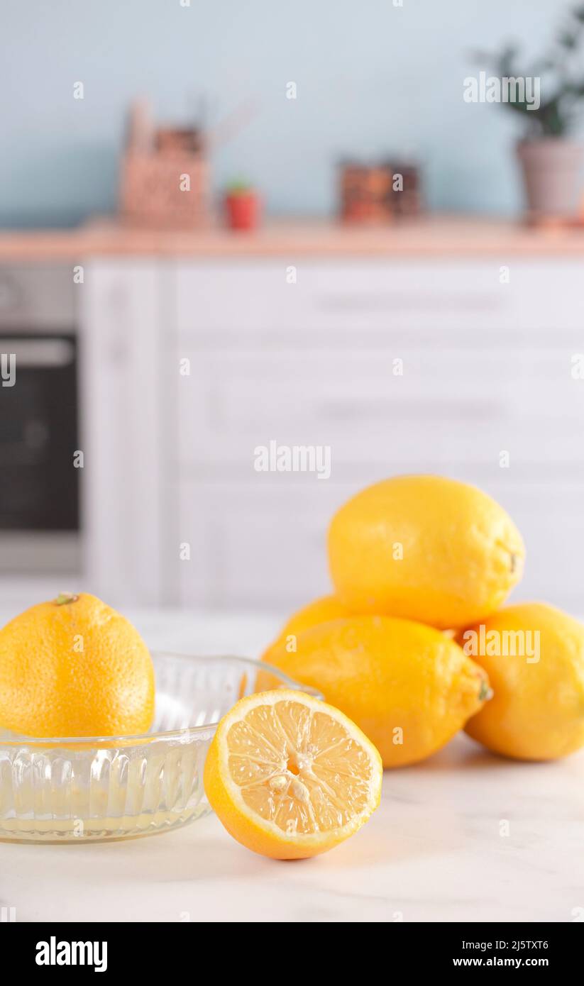 Lemon Being Juiced on a Marble Kitchen Counter Stock Photo - Alamy