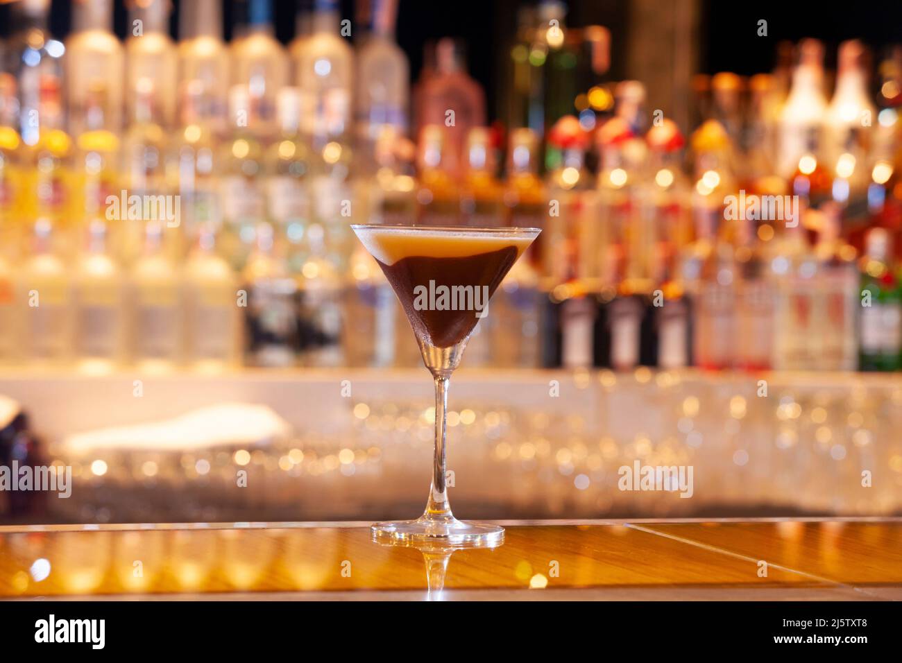 Colorful drink on the background of bottles in original shapes ...