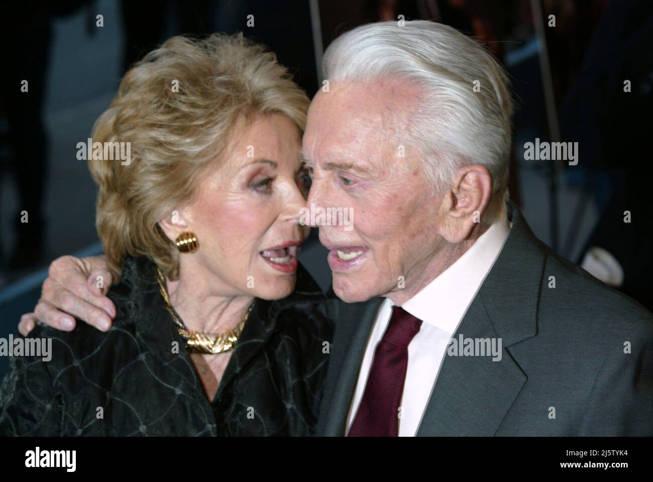 Kirk Douglas and wife Anne Buydens attend the premiere of "It Runs in ...