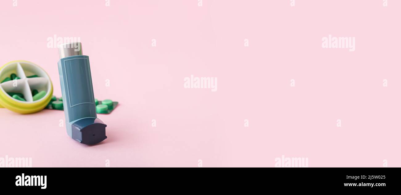 Asthma inhaler and pills on pink background with space for text Stock ...