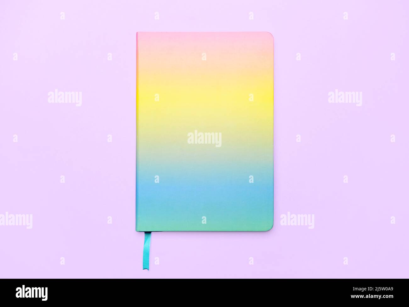 Bright notebook on lilac background Stock Photo - Alamy