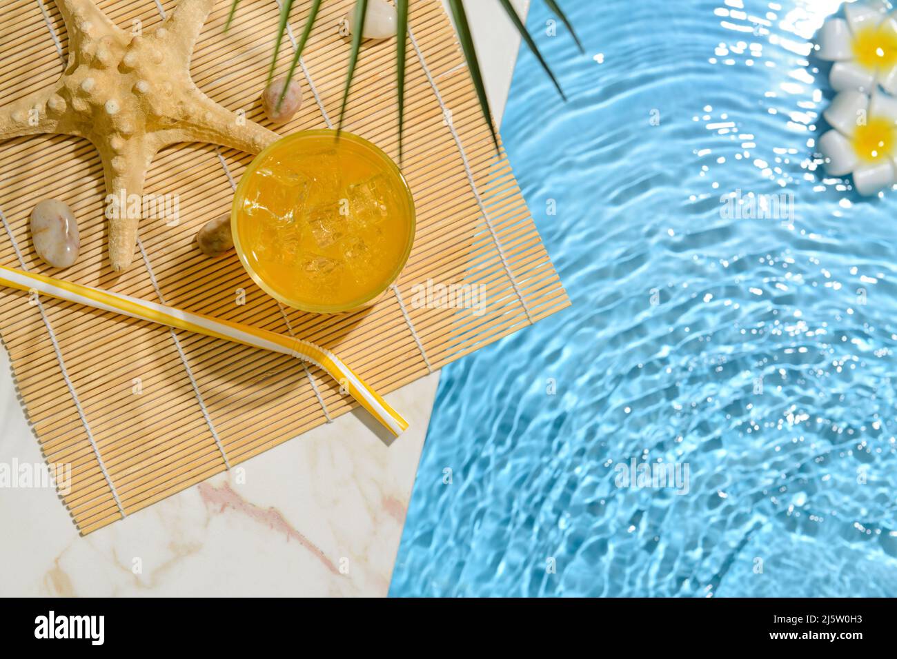 Glass of fresh soda near swimming pool Stock Photo - Alamy