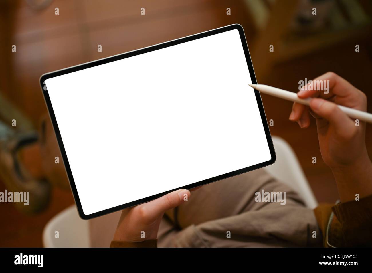 Above view, Female hands holding stylus pen and using digital tablet ...